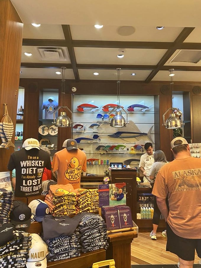 Even the merchandise corner embraces the nautical humor – because nothing says "I survived vacation" like a t-shirt declaring your whiskey diet.
