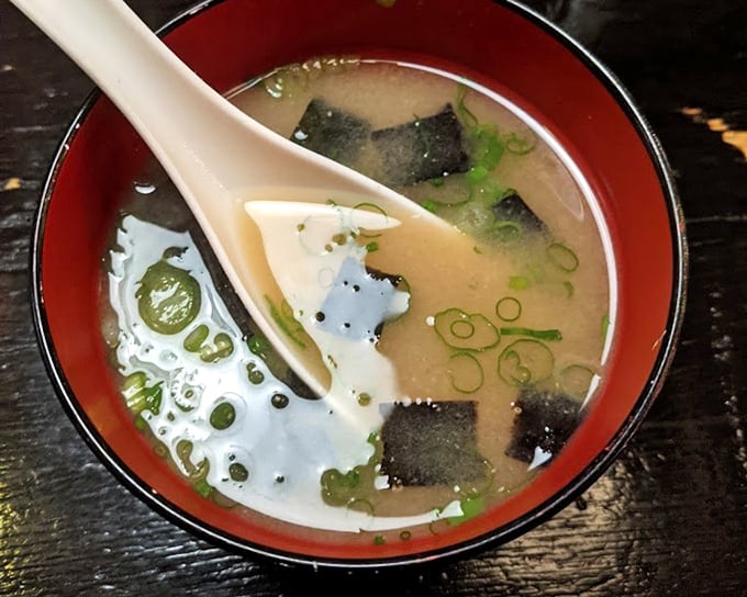 Miso soup—the unsung hero of Japanese cuisine. This steaming bowl offers comfort that chicken noodle can only dream about.