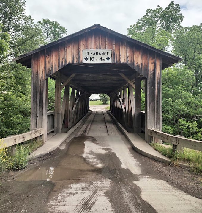 After rain, the bridge's entrance takes on a moody, cinematic quality—ready for its close-up in a period film.