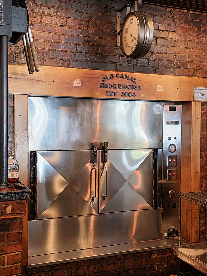 The smoker—a gleaming steel altar where ordinary cuts of meat undergo their miraculous transformation into barbecue transcendence.