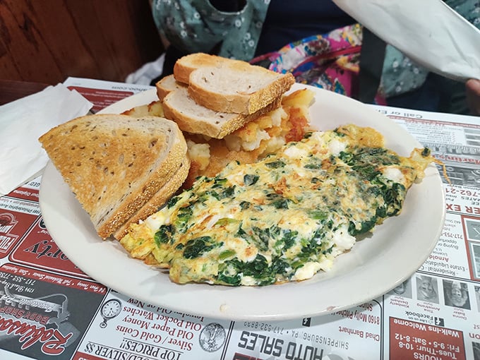 A spinach and cheese omelet that's perfectly executed—fluffy, not rubbery—with a side of home fries that puts fast-food breakfast to shame.