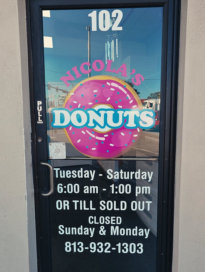 The door tells the truth: arrive early or face the consequences. "Till sold out" isn't a suggestion—it's a daily reality for donut devotees.