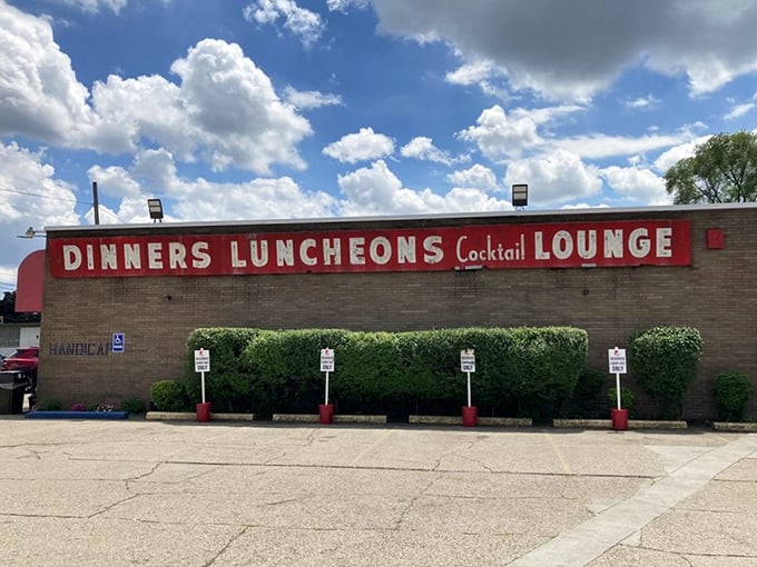 DINNERS LUNCHEONS Cocktail LOUNGE—a sign promising everything you need for happiness under one humble roof.