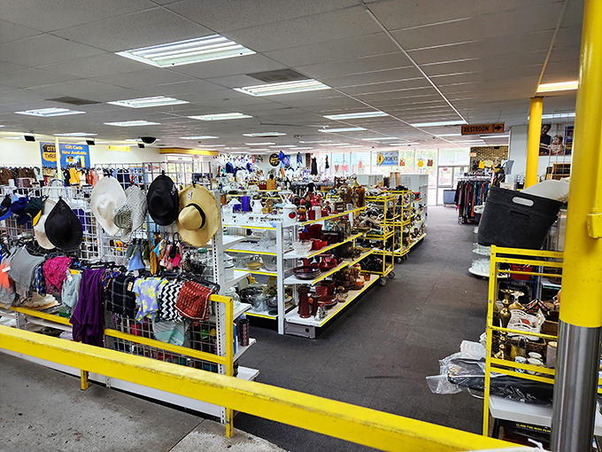 A thrifter's panorama of possibility. Those hanging hats aren't just accessories—they're identities waiting to be borrowed or reinvented.