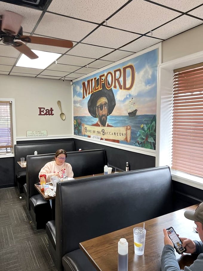 More pirate-themed decor watches over diners – because nothing says "hearty breakfast" quite like the watchful eye of a buccaneer.