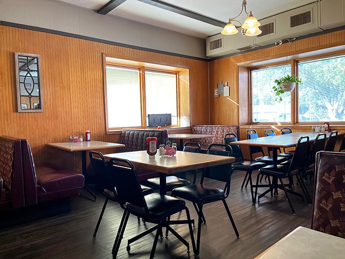 Wood paneling, booth seating, and natural light streaming through windows—Harvey's dining room feels like the community living room where everyone's welcome.