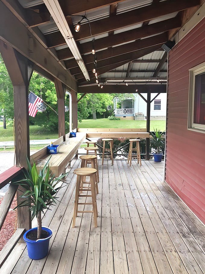 The covered porch offers al fresco dining with a side of Americana—where summer evenings stretch out like the perfect country song.