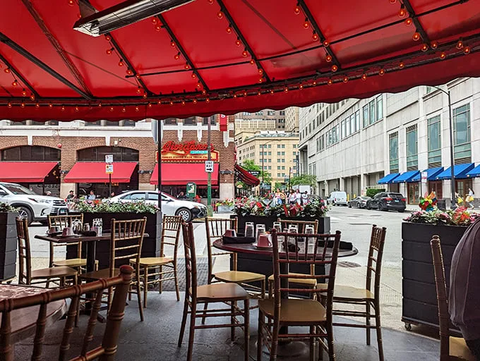 The covered patio offers front-row seats to the Rush Street theater, where Chicago's urban drama unfolds while you twirl pasta in blissful detachment.