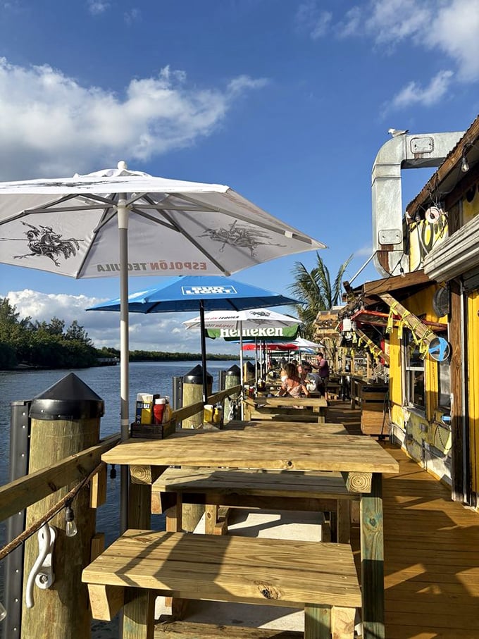 Waterfront dining doesn't get more authentic than this—simple wooden tables, market umbrellas, and the Intracoastal providing nature's entertainment.