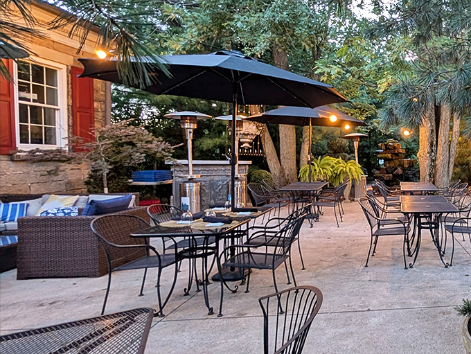 The outdoor patio offers a serene retreat—where summer evenings, good wine, and the absence of cooking responsibilities create perfect harmony.