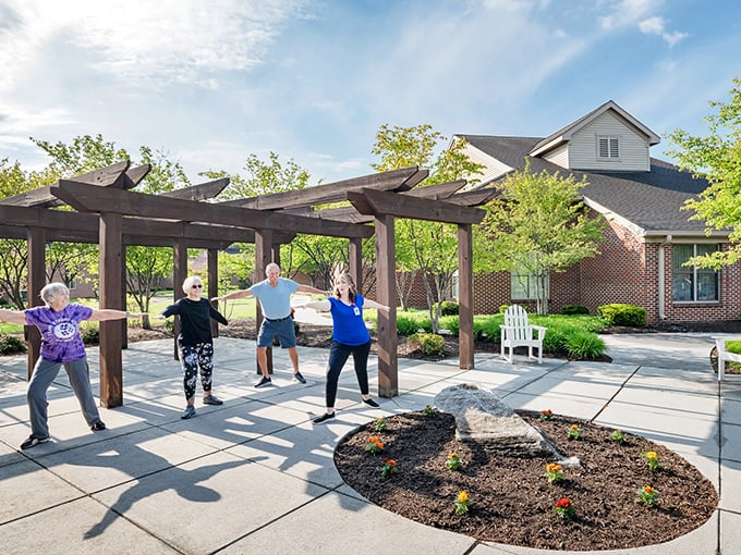 Morning tai chi under the pergola—where "I used to be able to touch my toes" meets "who cares, I'm having fun anyway."