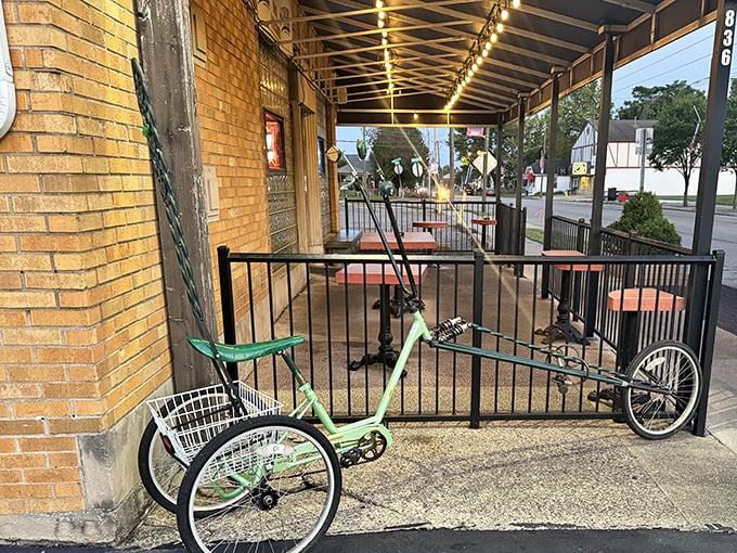 The covered porch offers al fresco dining with a side of people-watching—and that green tricycle has probably heard some stories.
