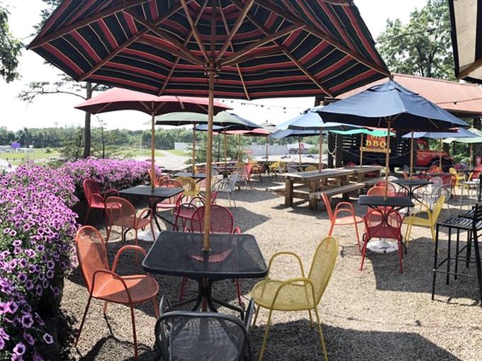 The outdoor patio – where purple flowers and colorful chairs create a cheerful oasis for enjoying ribs while watching the world float by.