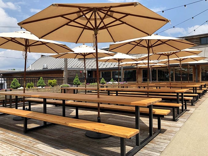 The outdoor biergarten—where Pennsylvania summer days stretch into perfect evenings under umbrellas that shade you from everything except good times.