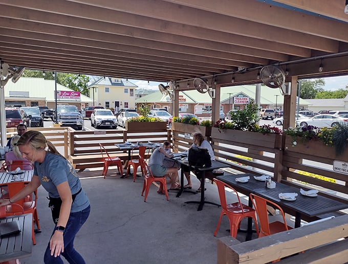 The outdoor patio isn't just a place to eat—it's an extension of Delaware's relaxed coastal vibe, where conversations flow as easily as the cocktails.