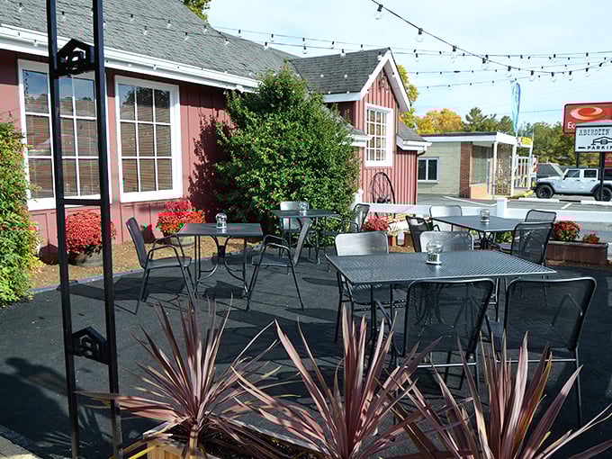 The outdoor patio offers al fresco dining with string lights overhead—proof that even classic steakhouses know how to embrace modern dining trends.