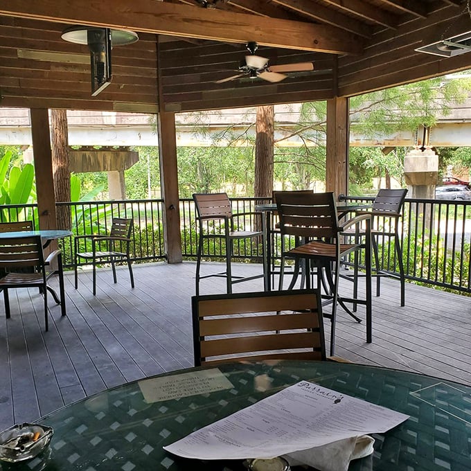 Outdoor seating that brings Louisiana's lush greenery right to your table – perfect for those "too pretty to eat inside" kind of days.