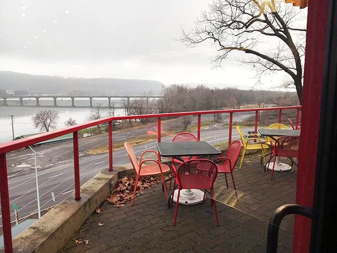 Winter riverside dining has never looked so inviting—those colorful chairs waiting for warmer days and sauce-stained fingers.