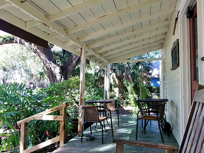 The outdoor seating area whispers, "Stay awhile," as dappled sunlight filters through ancient oaks – nature's perfect dining room.