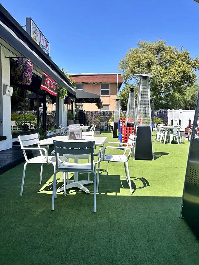 Florida sunshine and artificial turf create the perfect backdrop for outdoor dining where even the heat lamps look like they're having fun.
