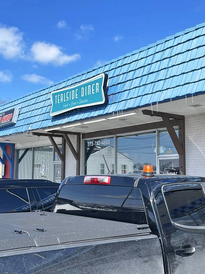 That blue roof isn't just eye-catching—it's a landmark that says, "Exit here, hungry traveler. Your breakfast salvation awaits."