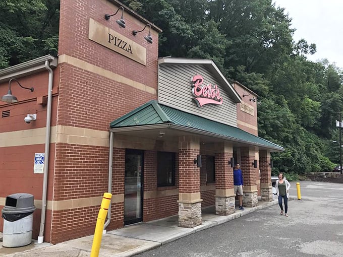 Rain can't dampen the Beto's experience—loyal customers navigate puddles for their cold-cheese fix. Some cravings transcend weather forecasts and sensible footwear choices.