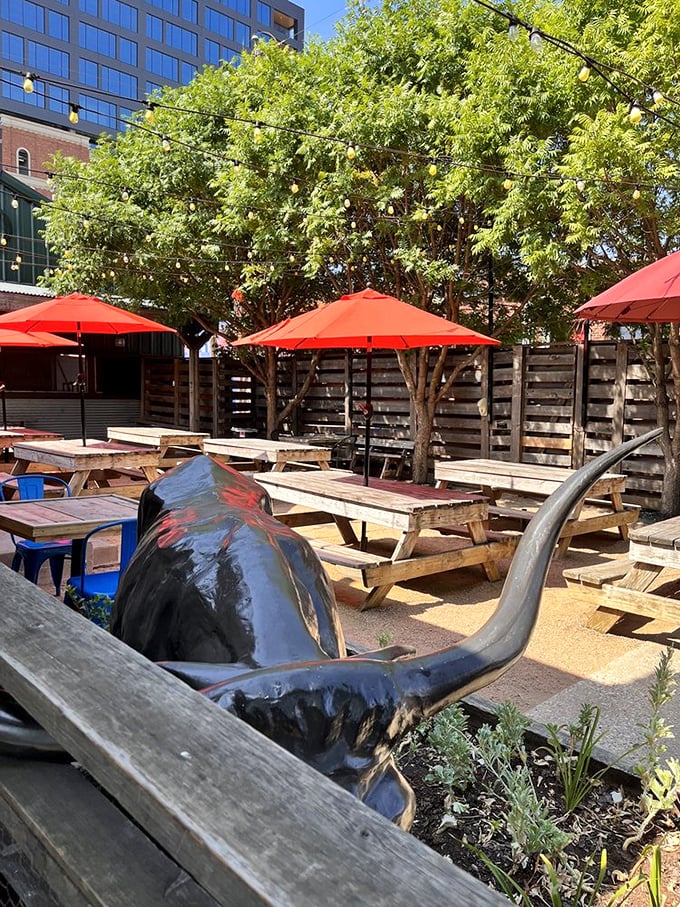 The outdoor seating area offers a Texas-sized respite, complete with longhorn décor that reminds you exactly where your BBQ allegiance should lie.