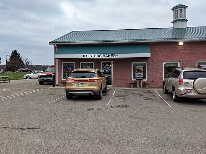 The parking lot – where vehicles gather like pilgrims at a shrine, their drivers united in pursuit of flaky, buttery enlightenment.