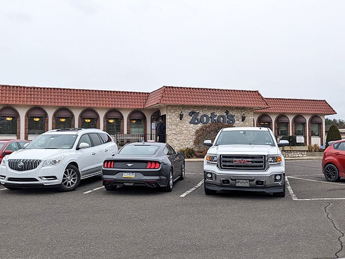 The parking lot tells its own story—luxury cars next to work trucks, because great food is the ultimate social equalizer.
