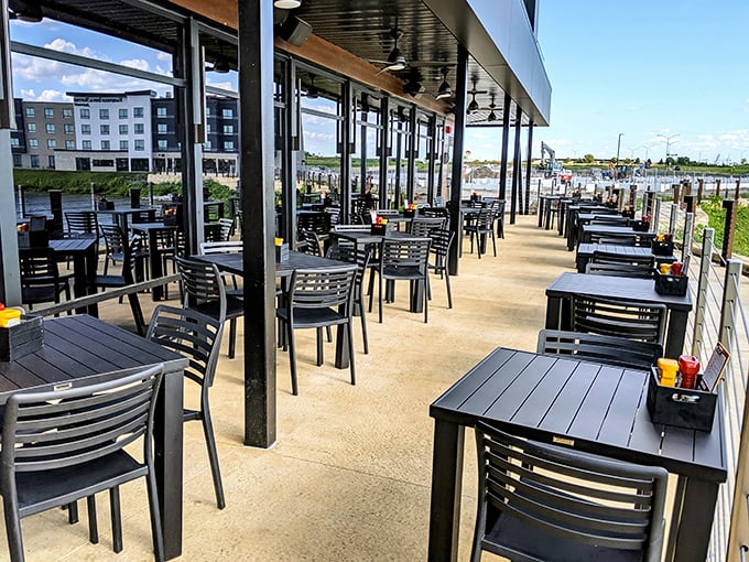 Iowa summer dining perfection: fresh air, cold drinks, and the anticipation of burgers that will make you forget you're eating outdoors.