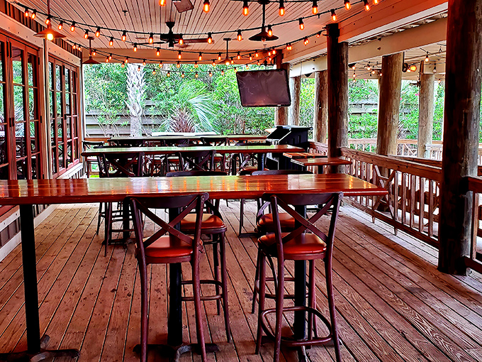 The covered patio offers string lights, sea breezes, and the distinct feeling that you've discovered the best seat in Destin.