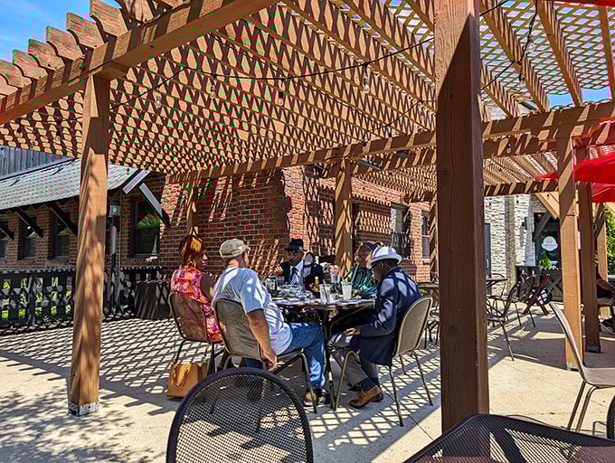 The pergola-covered patio offers al fresco dining with dappled sunlight—nature's perfect filter for both your meal and your inevitable food photos.