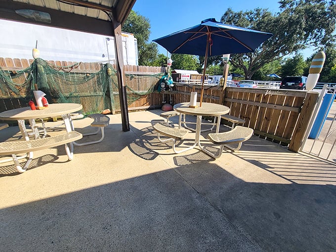 The humble patio offers fresh air dining with zero pretension – just picnic tables, umbrellas, and the promise of seafood satisfaction.