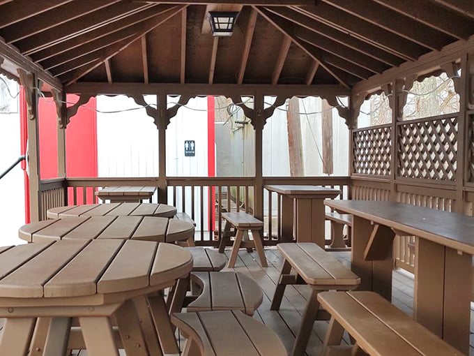 The covered patio—where strangers become friends over shared hot dog enthusiasm and the universal language of "mmm" and "you've got to try this."
