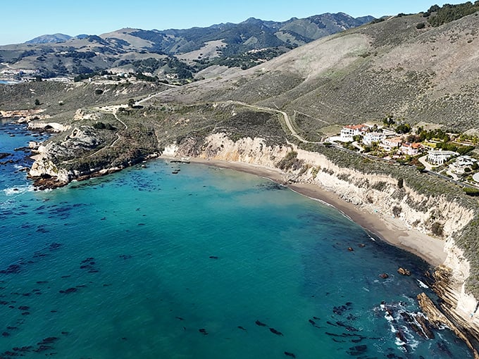 Pirates Cove Beach reveals itself like a secret treasure – turquoise waters and secluded shores that feel worlds away from everyday life.
