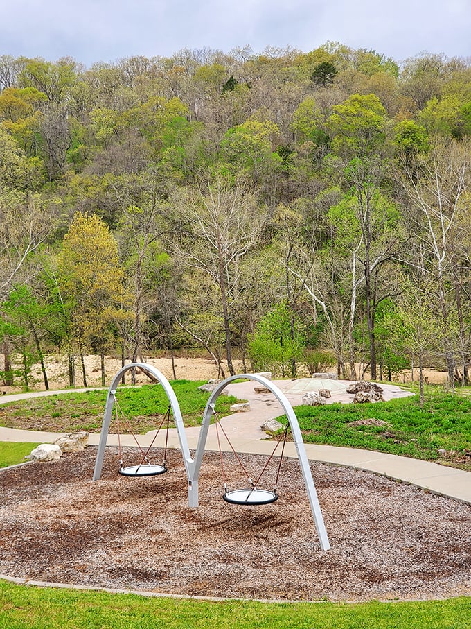 Modern playground equipment nestled in ancient hills—where kids can swing through time while parents soak in million-year-old views.