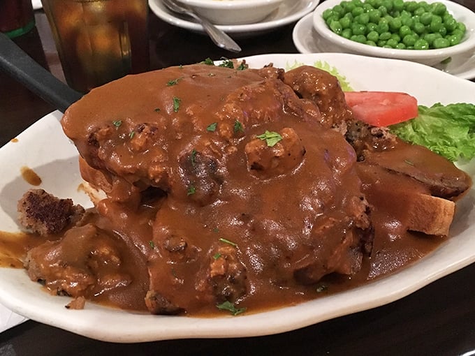 Gravy so good you'll want to swim in it. This pot roast surrenders completely to its savory bath, creating a dish that defines the word "comforting."