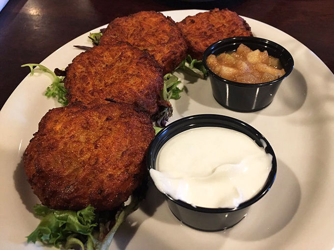 Potato pancakes with the perfect crisp-to-tender ratio, flanked by cool sour cream and sweet applesauce – the holy trinity of comfort food done right.