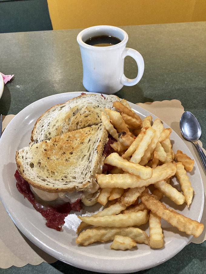 The Reuben sandwich—where corned beef, sauerkraut, and Swiss cheese hold their summit meeting, and world peace seems suddenly possible.