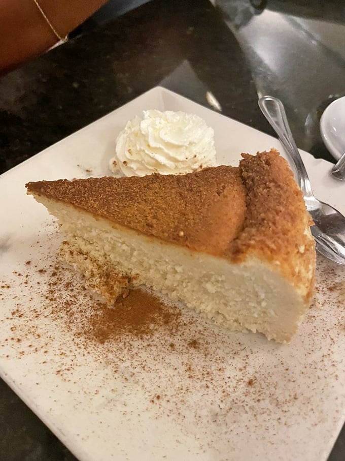 Ricotta cheesecake that whispers rather than shouts its sweetness, dusted with cinnamon like a final love note from the kitchen.