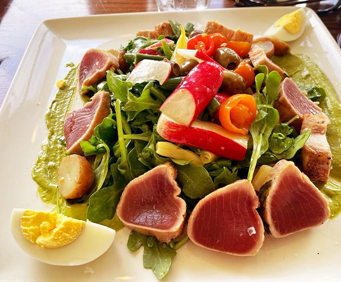 A salad that's having an identity crisis in the best way possible—fresh greens playing host to ruby-red tuna that steals the show.