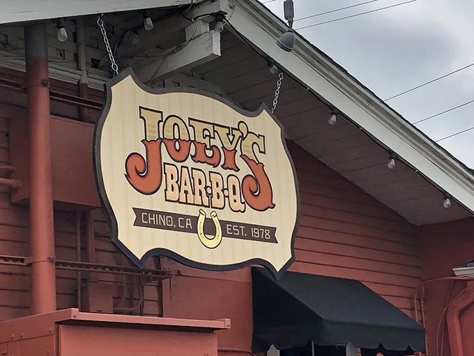 The hanging sign announces your arrival at meat paradise. That horseshoe isn't just decoration – it's catching all the good barbecue luck.
