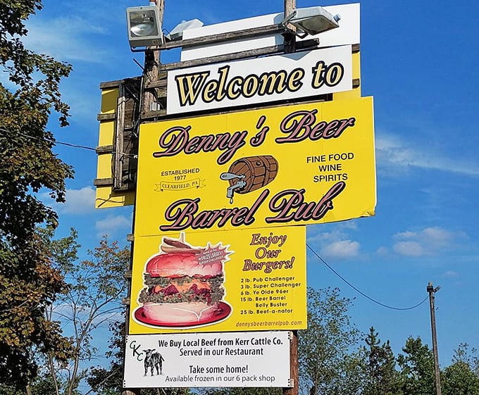 The roadside sign proudly announces burger challenges that range from ambitious to absolutely absurd. Two pounds is just the starting point!