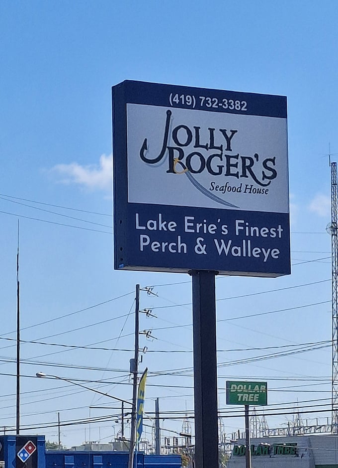 The sign proudly proclaims "Lake Erie's Finest Perch & Walleye"—a bold claim they back up with every golden-fried bite.