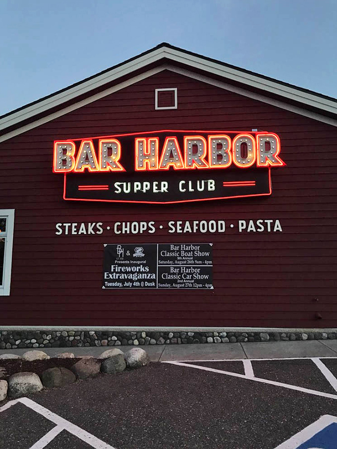 The neon sign glows like a lighthouse for hungry travelers—"Steaks, Chops, Seafood, Pasta" might be the four most beautiful words in English.