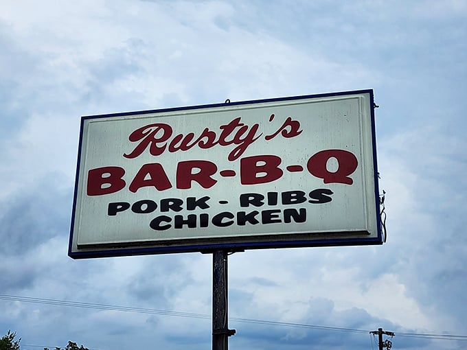 That roadside sign doesn't mince words – it tells you exactly what treasures await: pork, ribs, and chicken, all transformed by smoke and time.