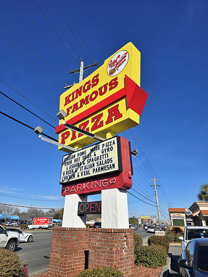 The iconic sign stands tall against Carolina blue skies, a landmark that's guided hungry travelers for generations.