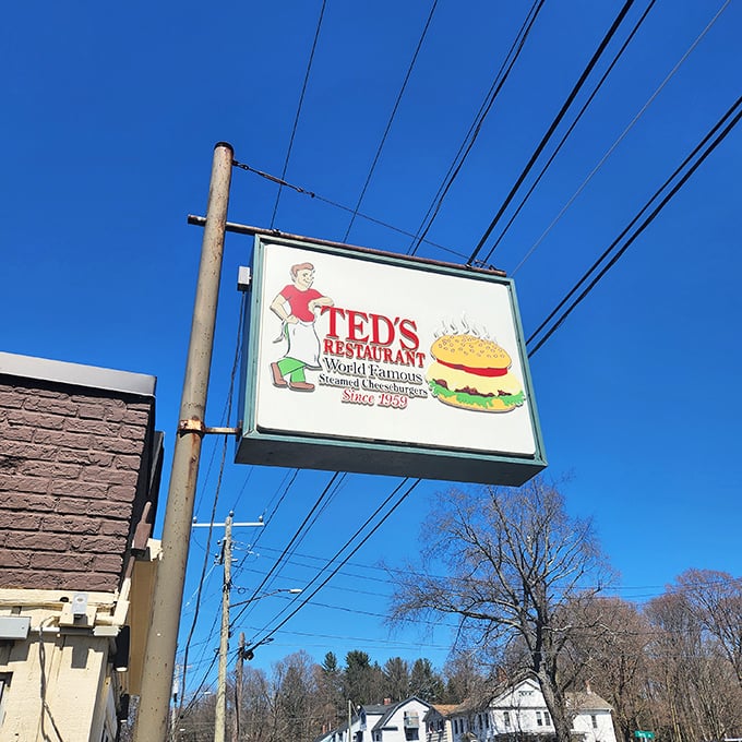 The iconic sign promises "World Famous" burgers—a rare case where roadside advertising actually undersells the experience.