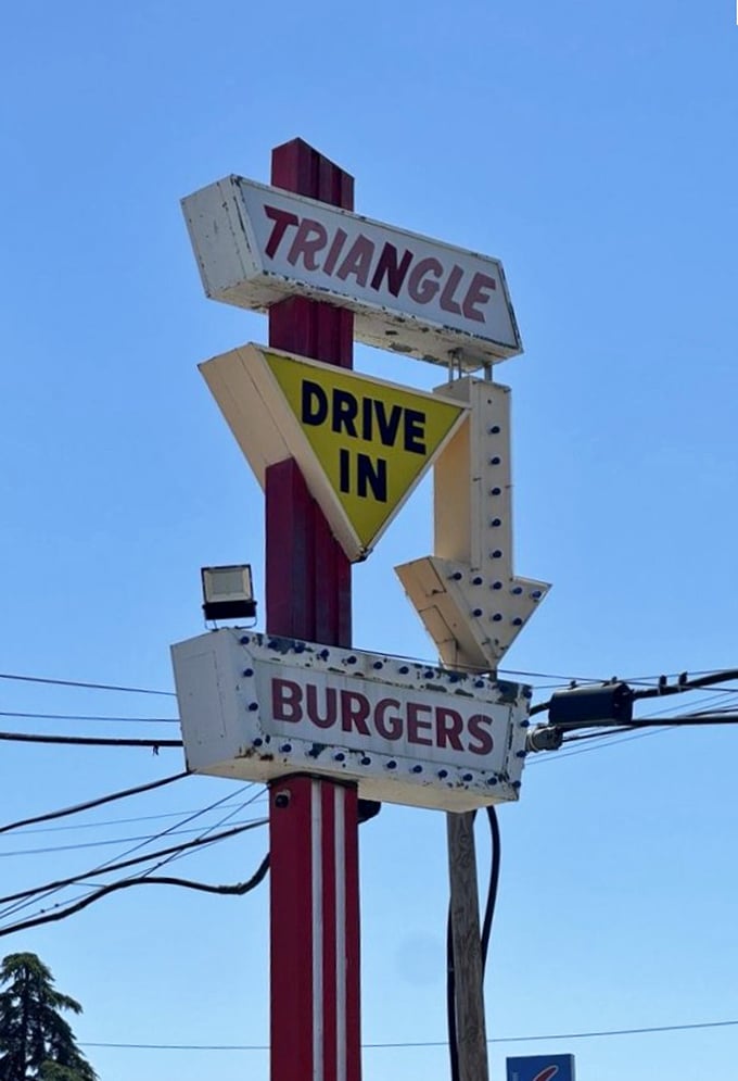 Not just a sign – a landmark that's guided hungry travelers through Fresno for decades with three-sided wisdom.