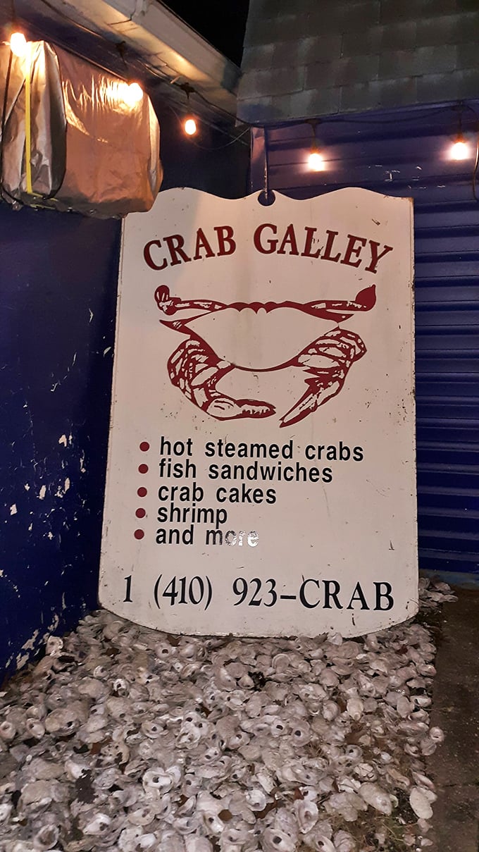 The sign says it all—hot steamed crabs, fish sandwiches, crab cakes, shrimp, "and more." That "and more" is doing some heavy lifting here.